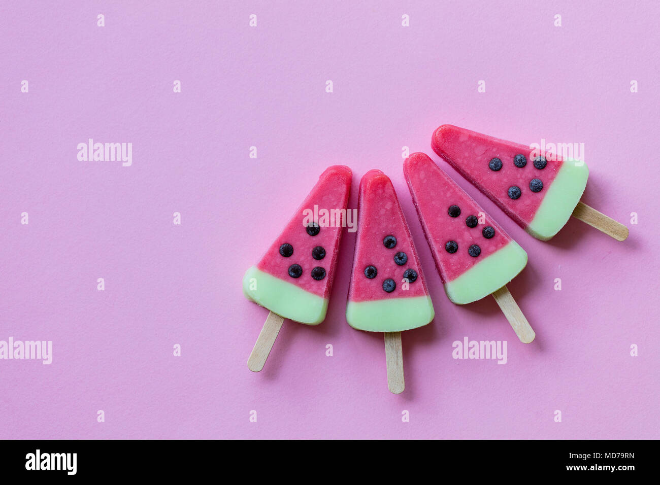 Watermelon shaped summer ice lolly on a pastel pink background Stock ...