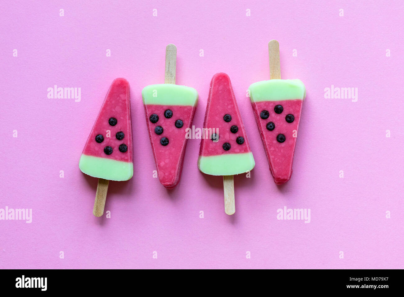 Watermelon shaped summer ice lolly on a pastel pink background Stock ...