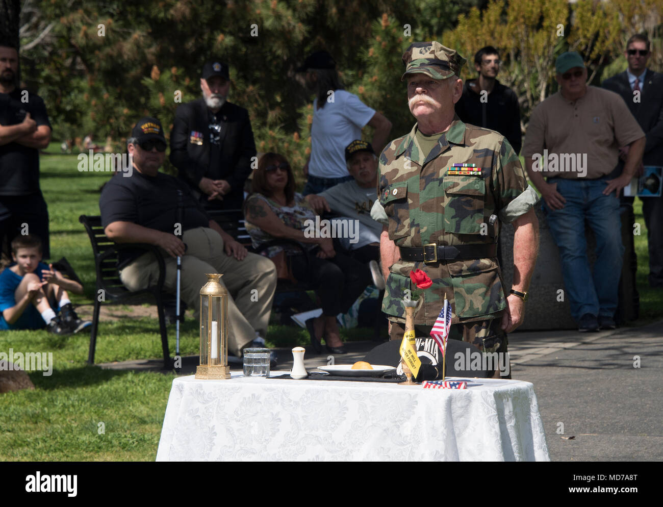 Greg McNeil performs the Prisoner of War/Missing in Action ceremony ...