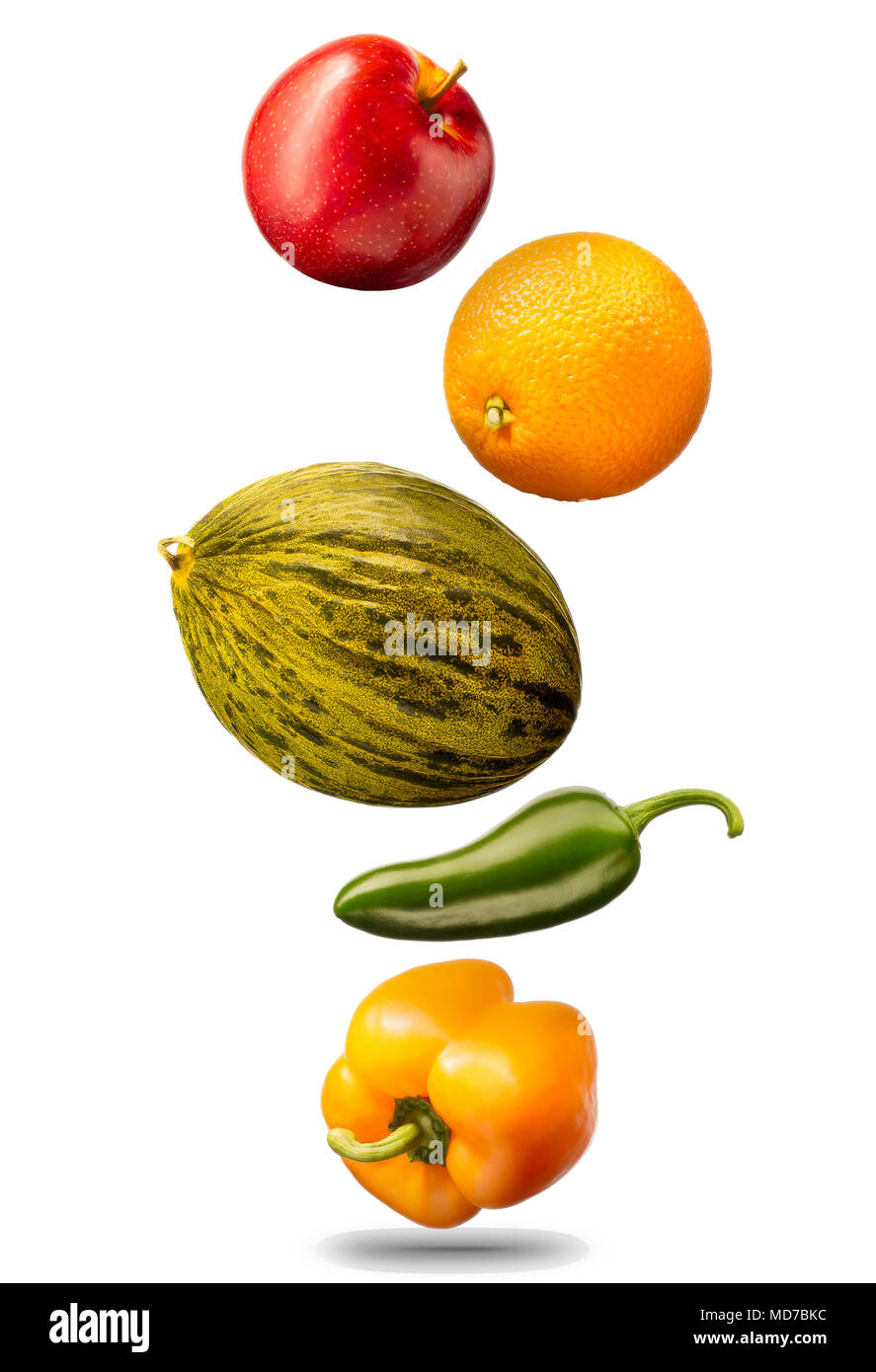 Falling fruits and vegetables isolated on white background with ...