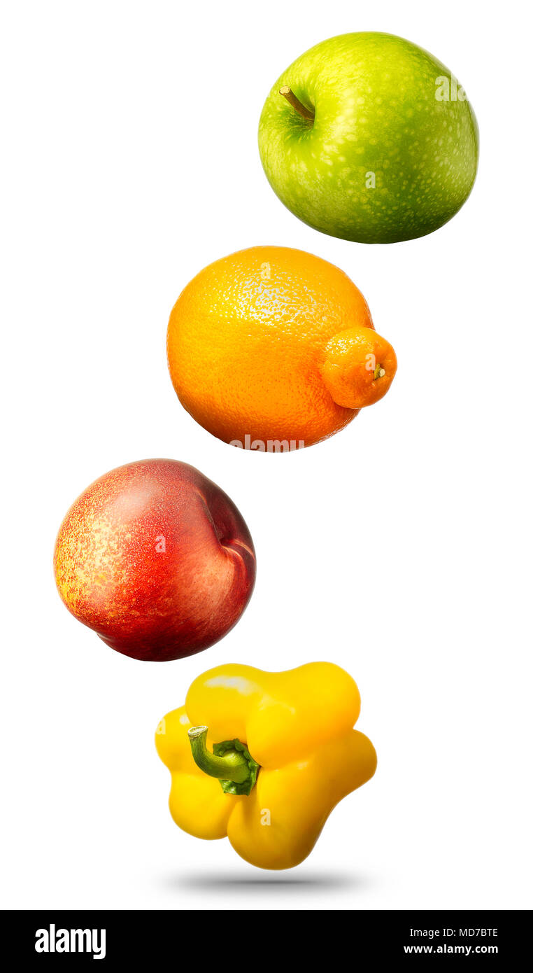 Falling fruits and vegetables isolated on white background with ...