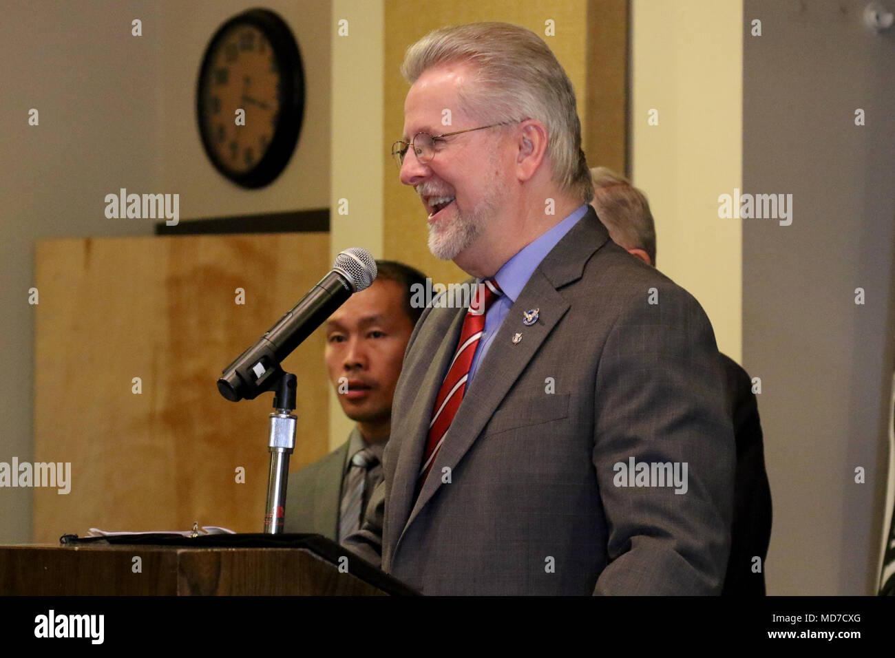 State Representative Warren Petryk sings "God Bless America" during ...