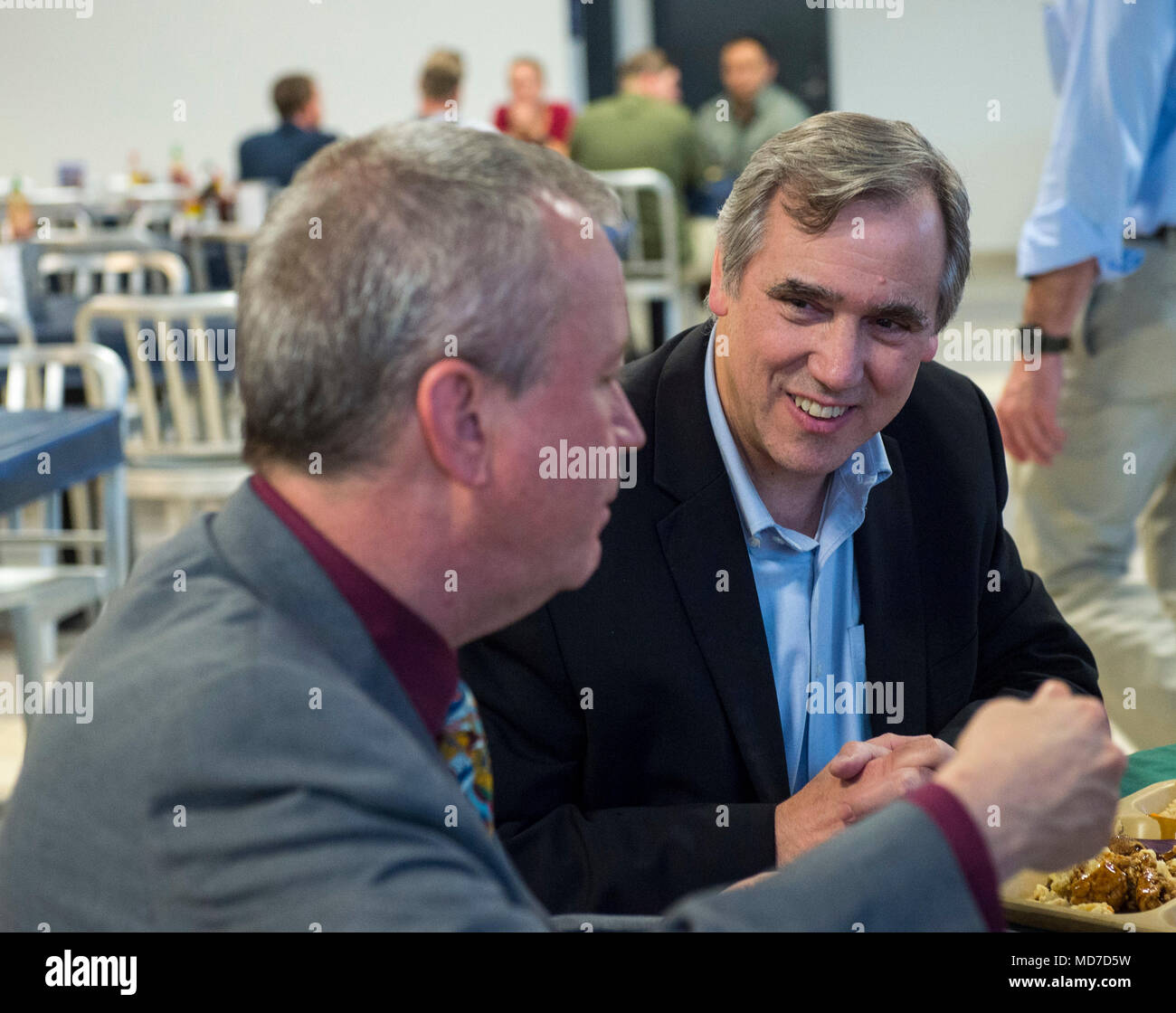 U.S. Sen. Jeff Merkley, right, Oregon, speaks with Larry André, U.S ...