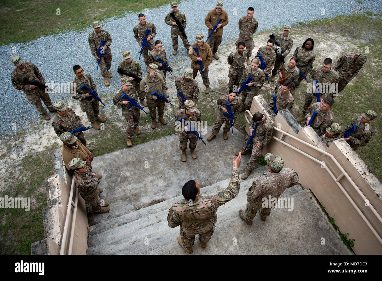 Airman from the 824th Base Defense Squadron get briefed during ...
