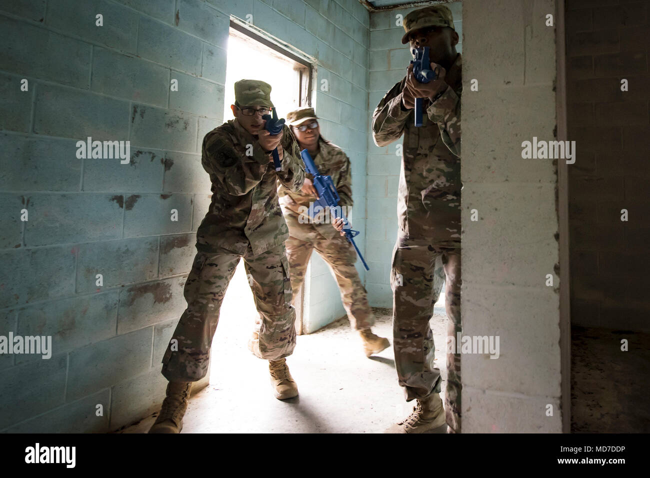 Airmen from the 820th Base Defense Group (BDG) enter a building during ...