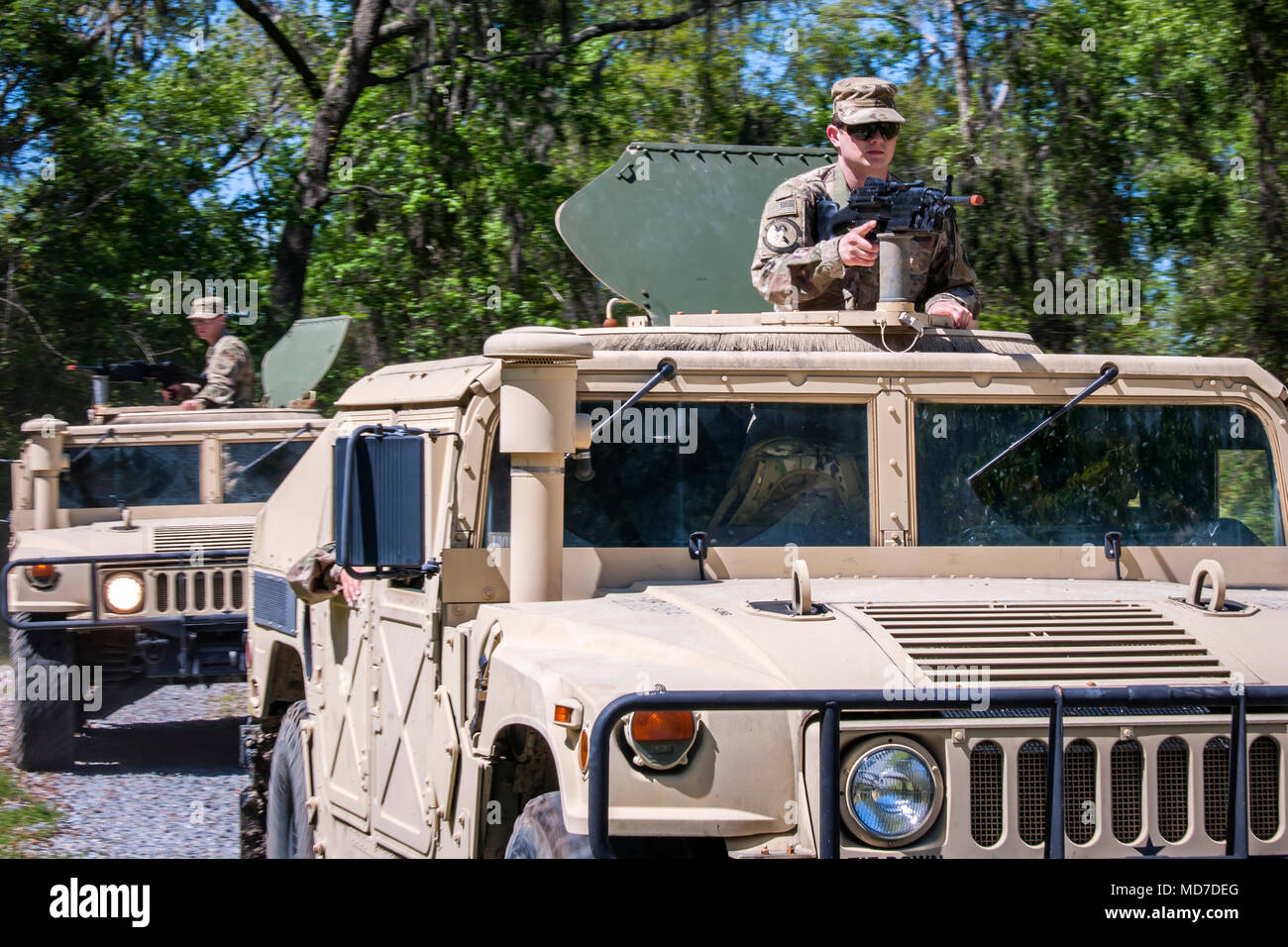 Airmen from 820th Base Defense Group (BDG), ride in a Humvee during ...