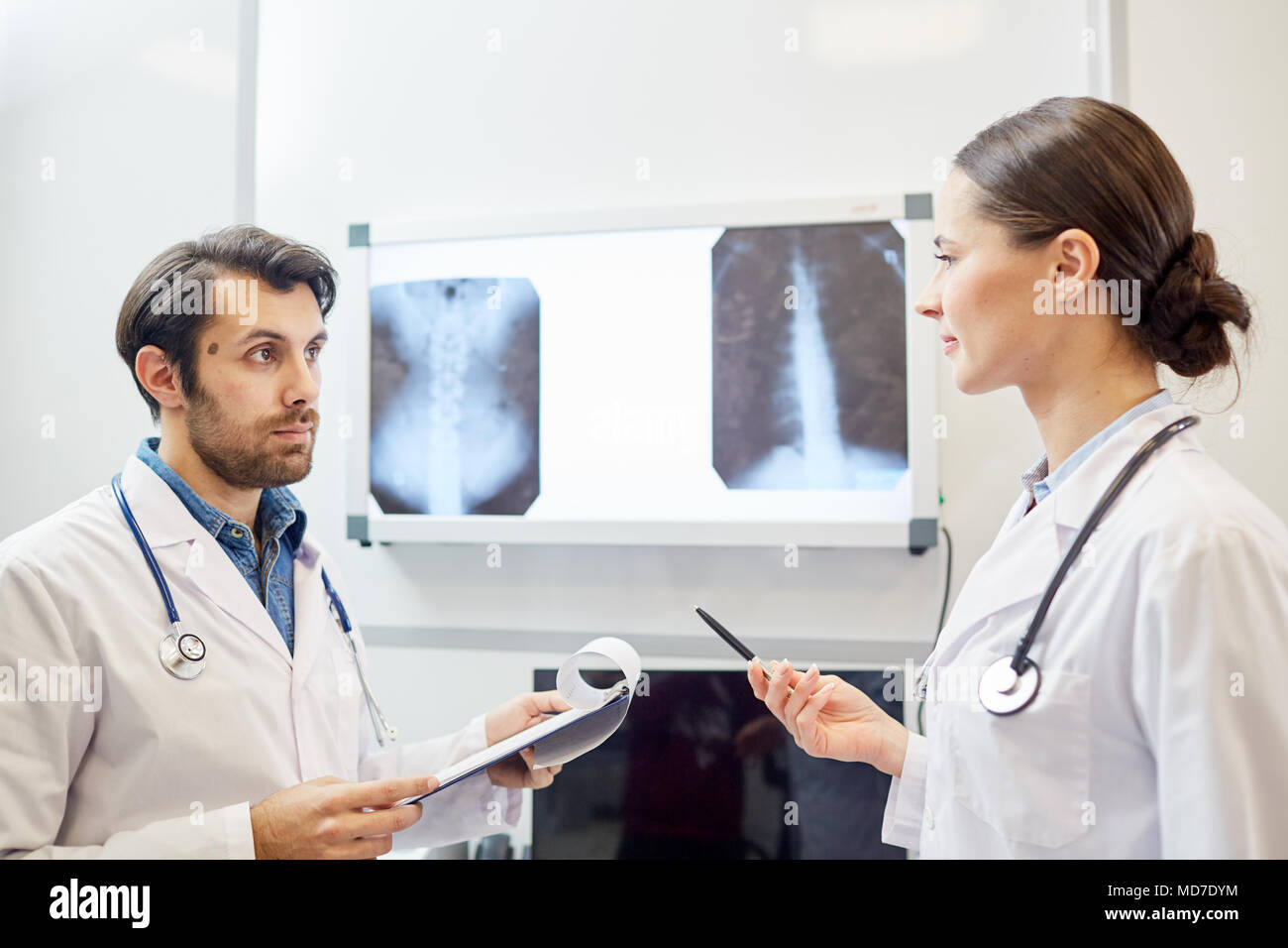Two surgeons communicating withh each other at the medical office Stock ...