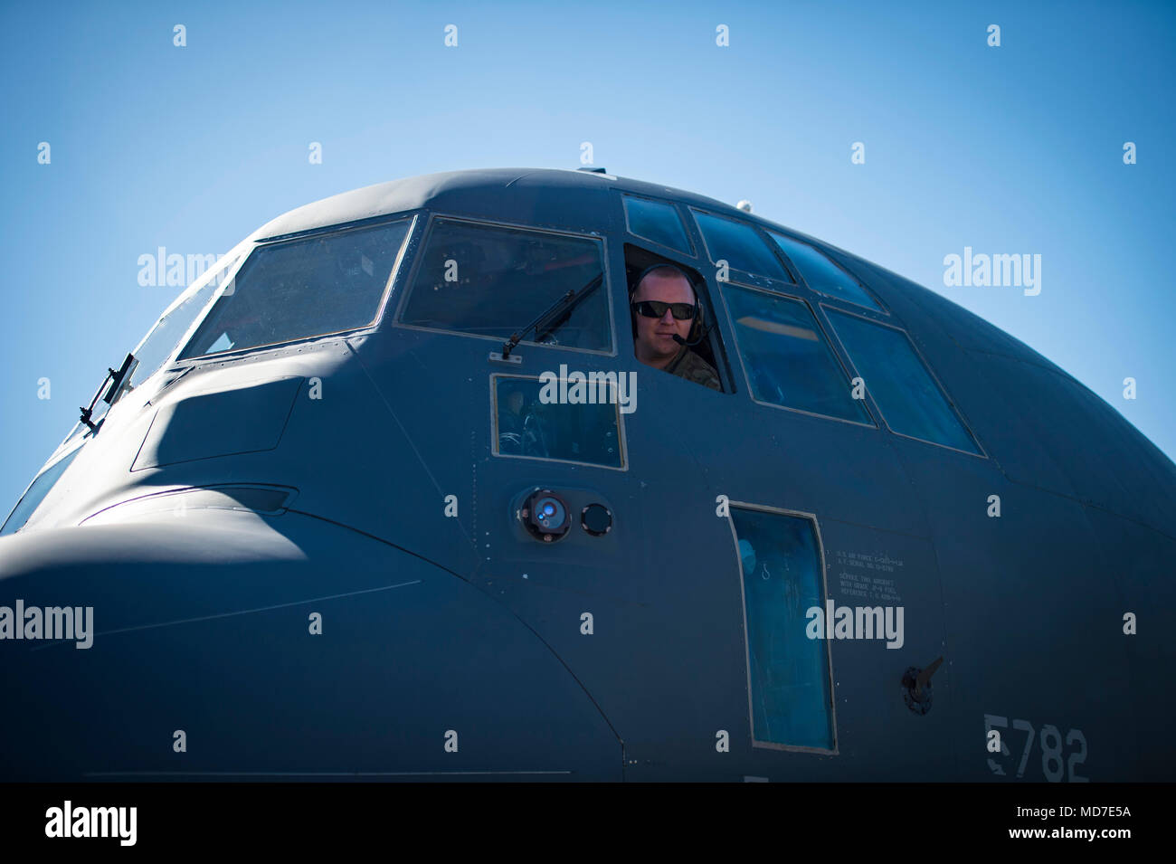 An Airman from the 71st Aircraft Maintenance Unit sits in an HC-130J ...