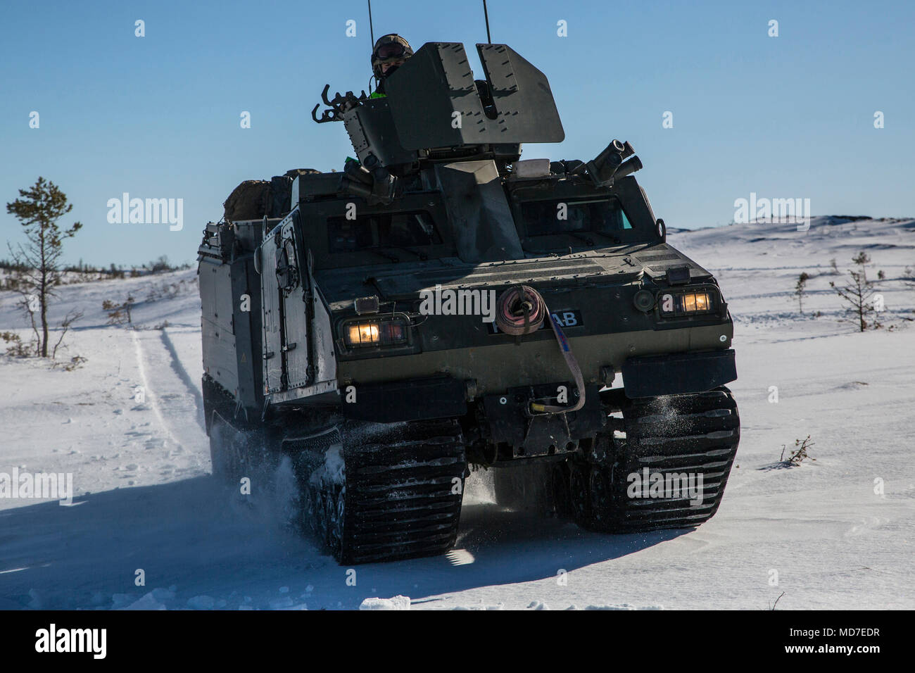 A British Royal Marines commando identifies obstacles and relays their ...