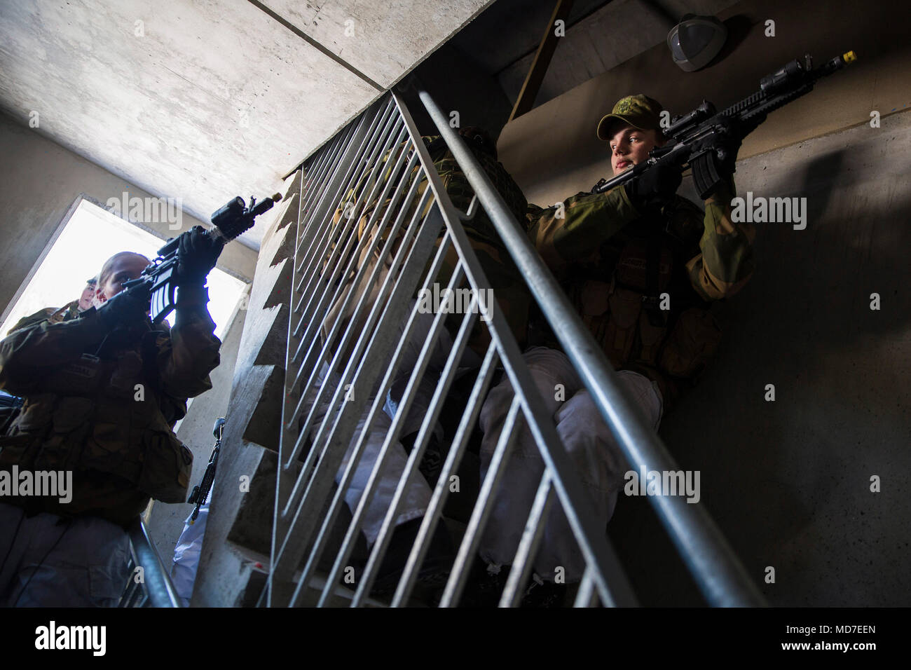 Norwegian soldiers demonstrate a room-clearing technique to law ...