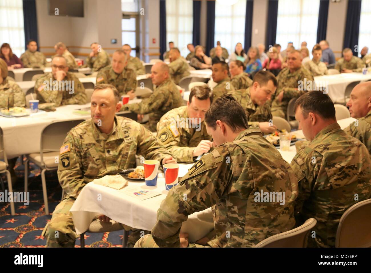 Installation community members listen to Col. Michelle Link, commander ...