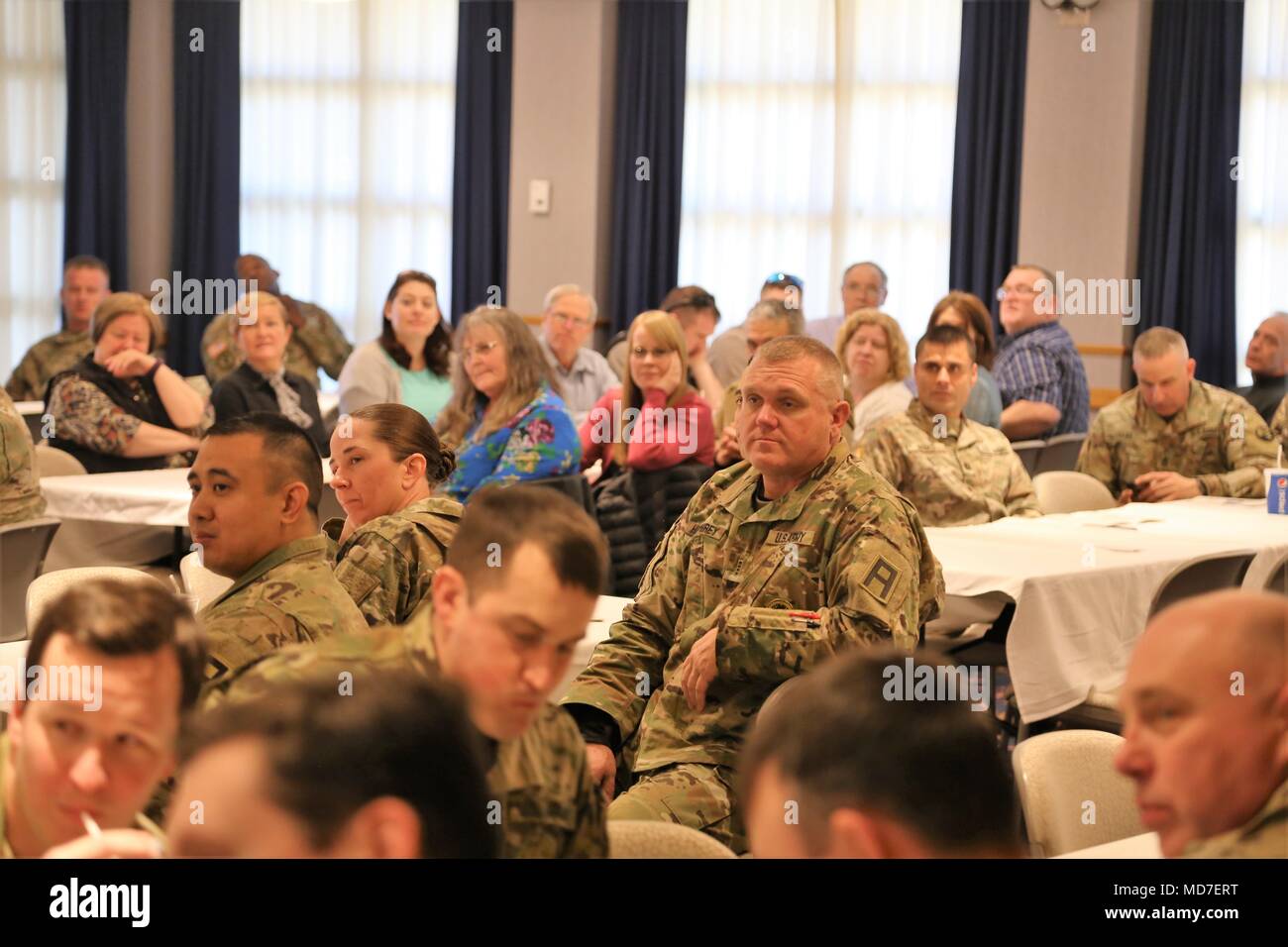 Installation community members listen to Col. Michelle Link, commander ...