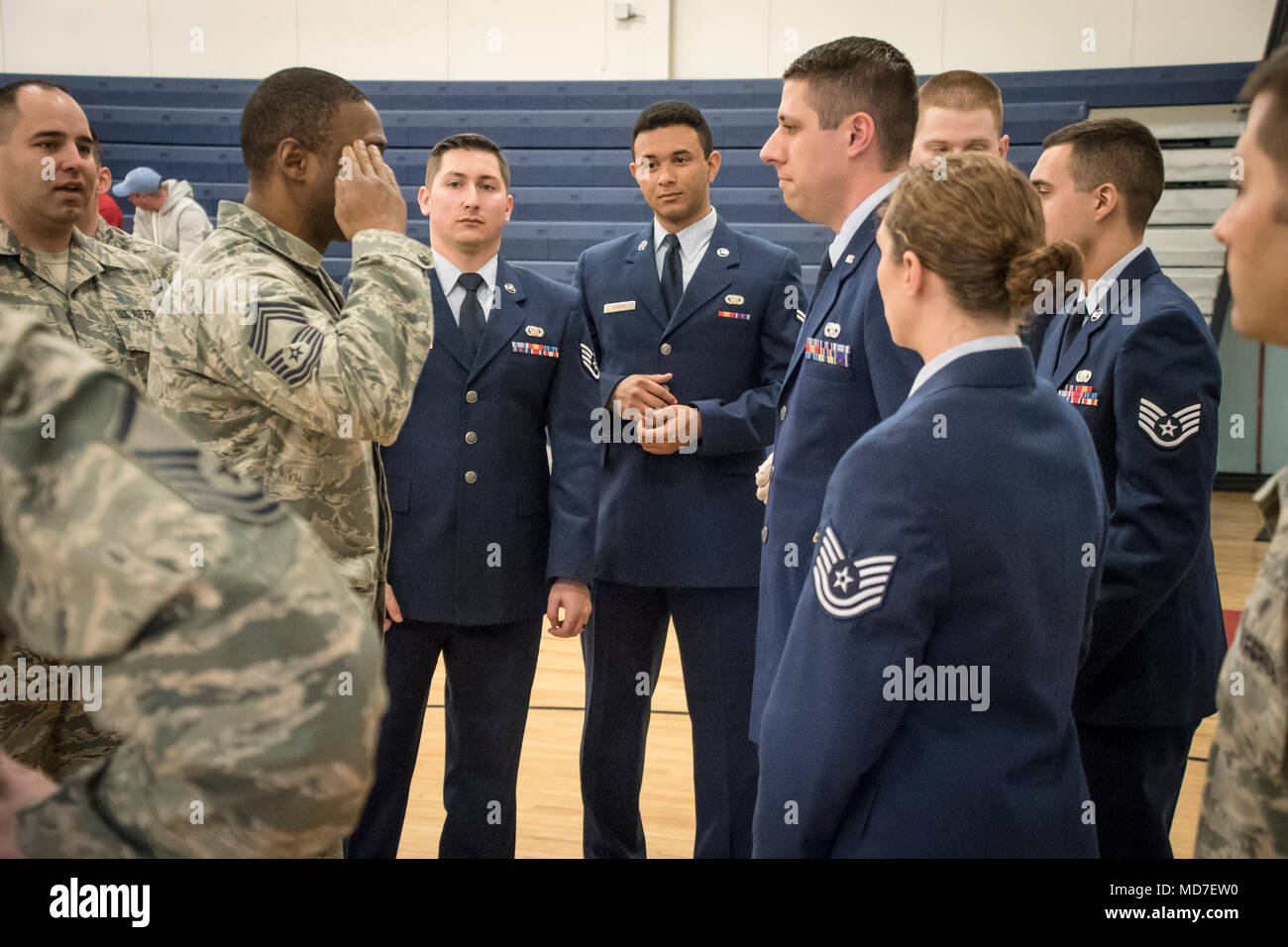 Chief Master Sgt. Shawn White salutes 1st Lt. Marshal Carpenter prior ...