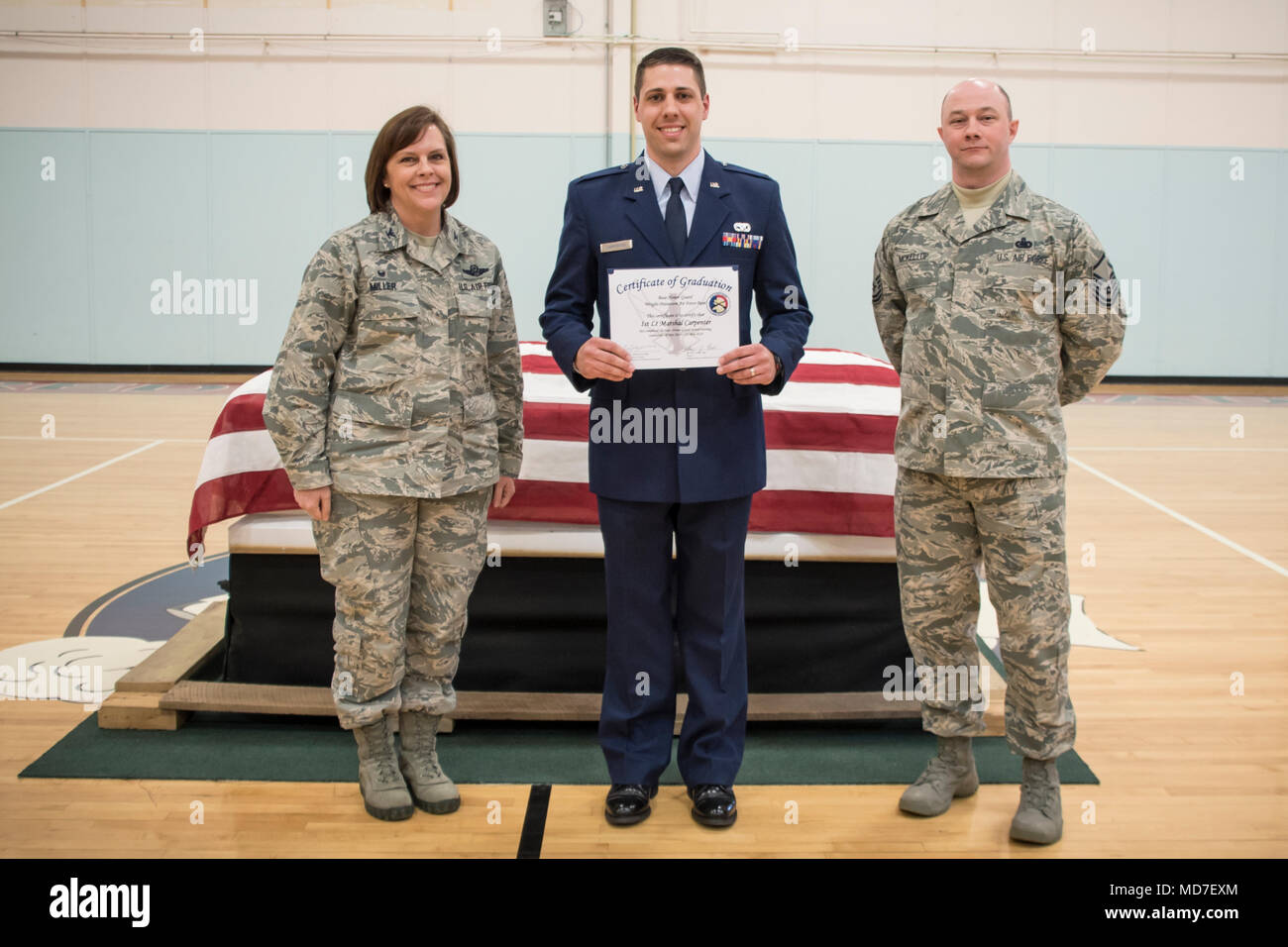 1st Lt. Marshal Carpenter stands with Col. Allison Miller and Master ...