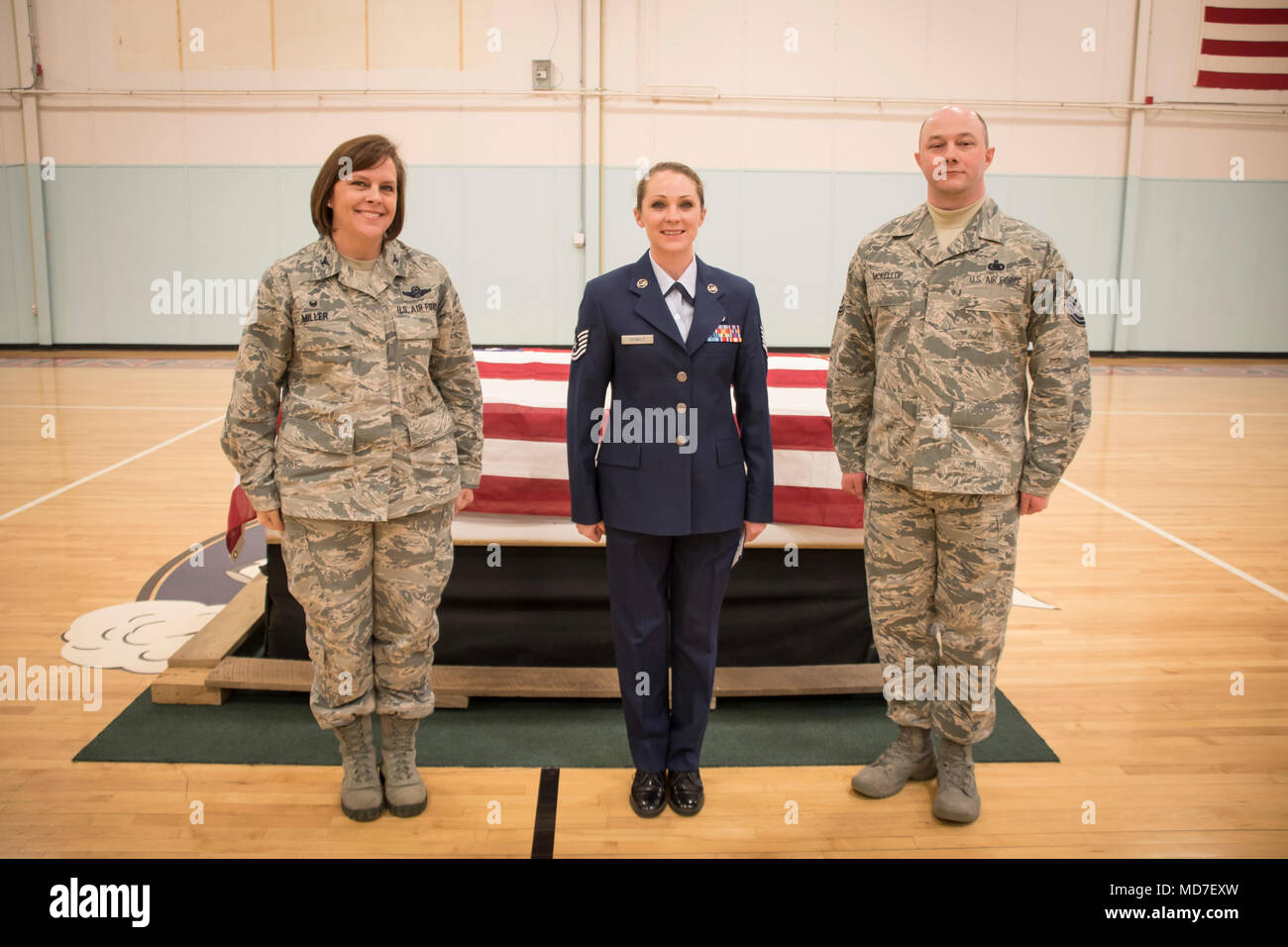 Tech Sgt. BreAnna Oswalt stands with Col. Allison Miller and Master Sgt ...