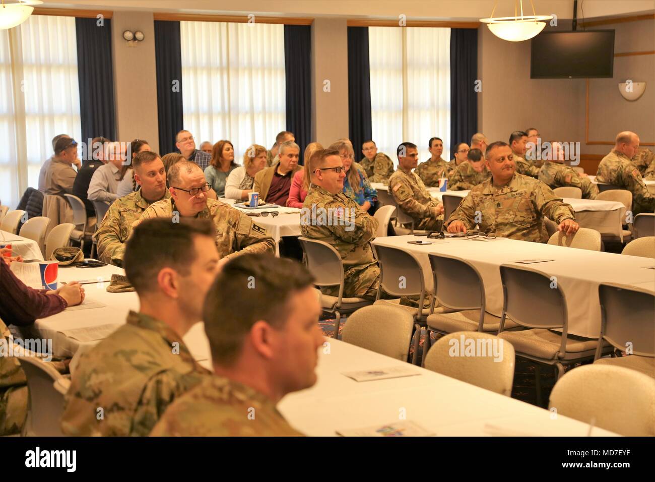 Installation community members listen to Col. Michelle Link, commander ...