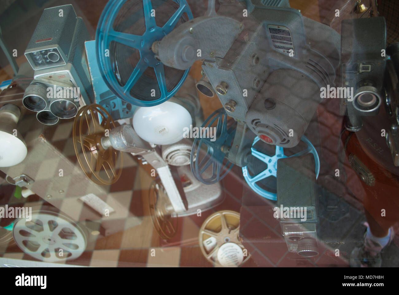 Shop-window, old, retro, aged photo, movie cameras close up ...