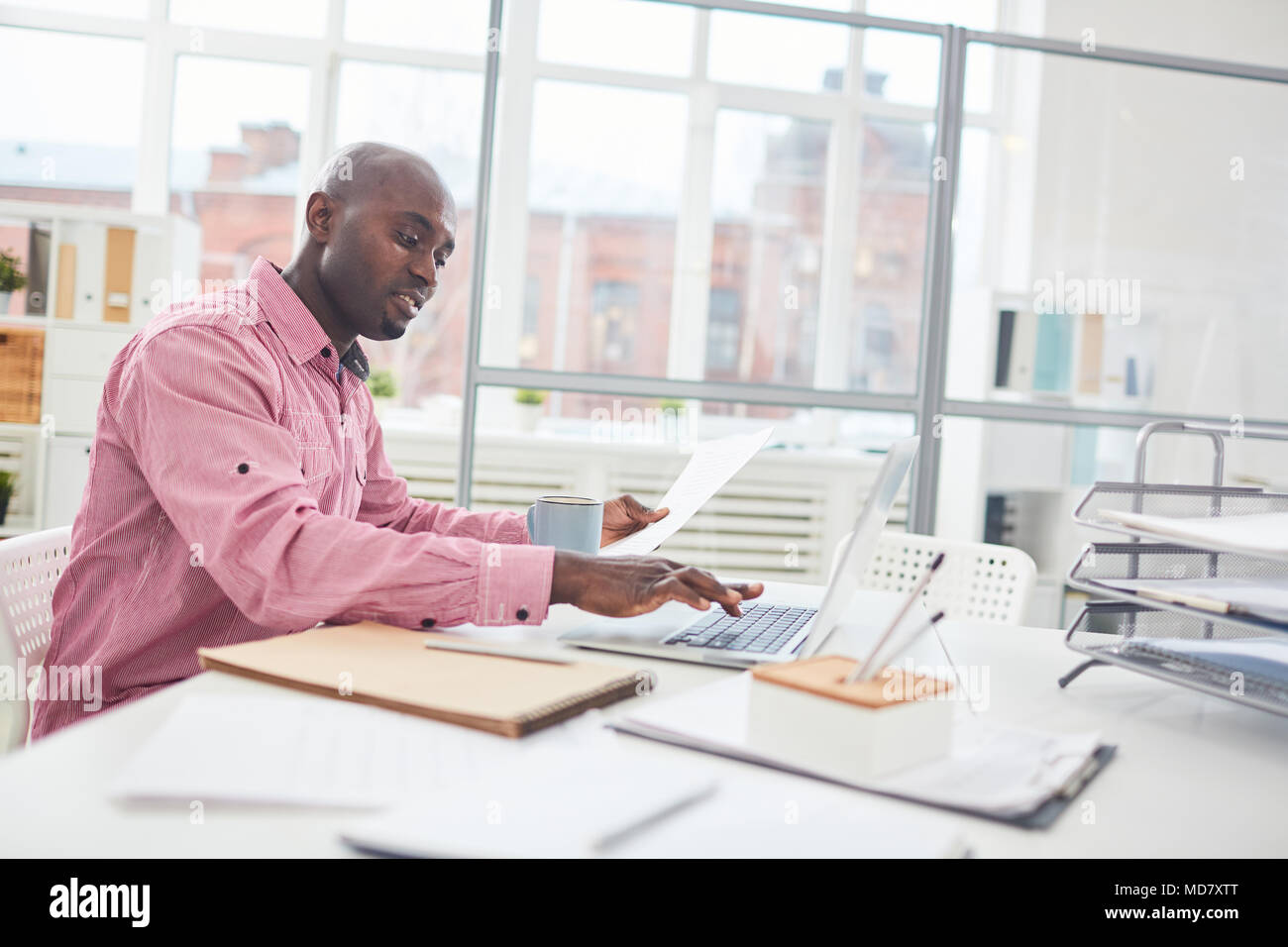 African businessman typing document hi-res stock photography and images ...