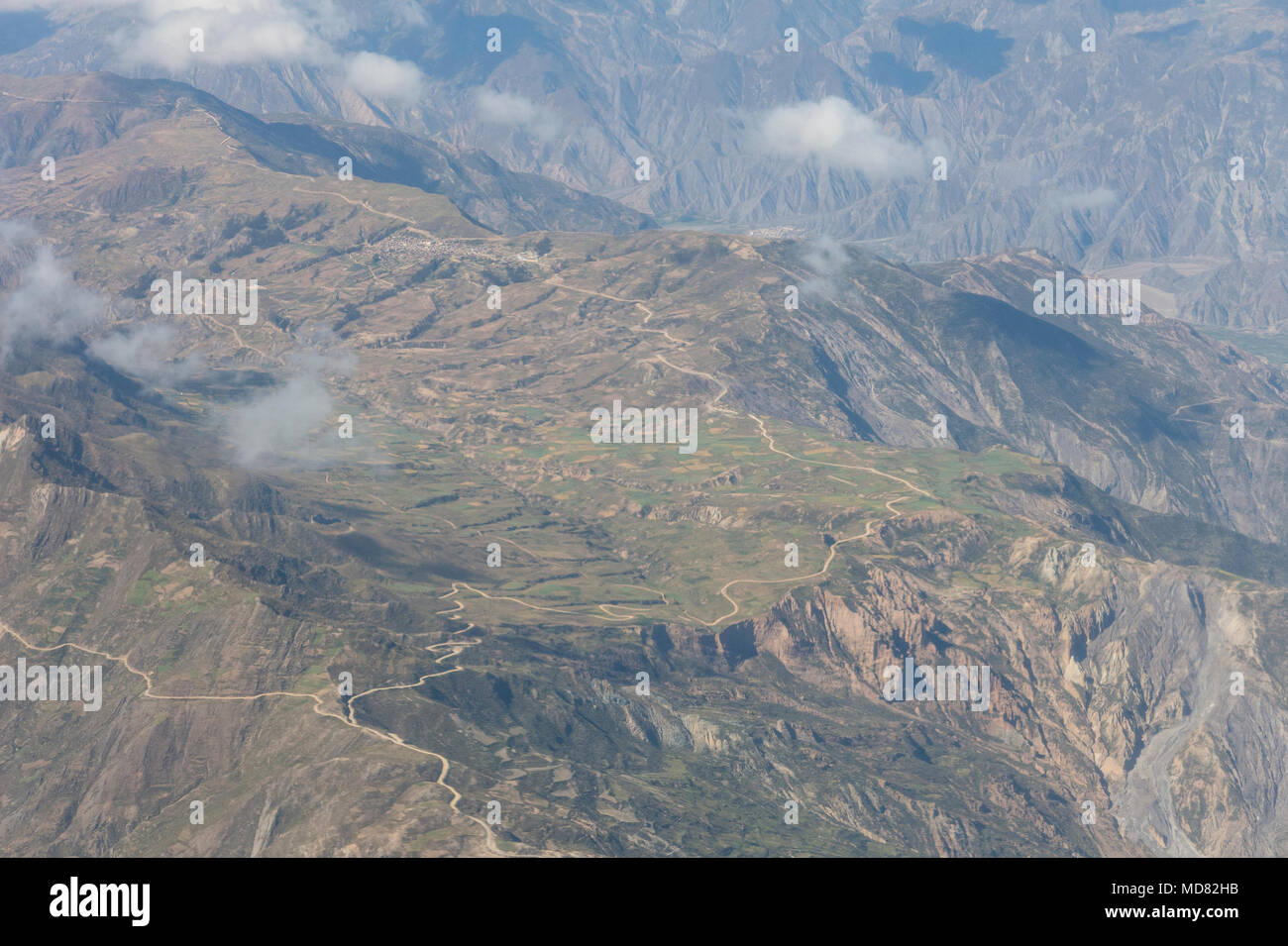 Aerial view of dry desert and the Andes Mountains somewhere over South ...