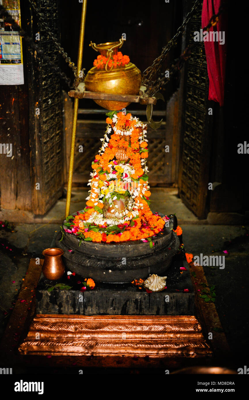 Hindu symbols and deity enshrined in flower garlands at Kanthwala ...