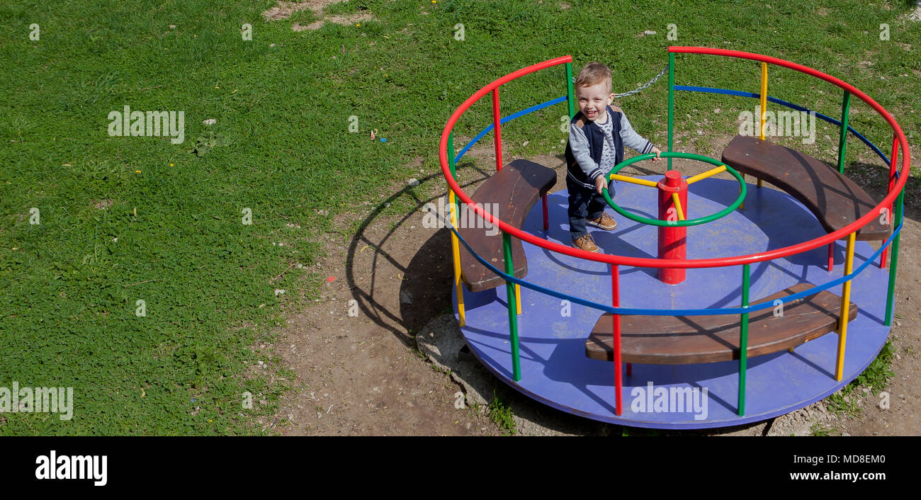 The child is riding a carousel, a view from above Stock Photo - Alamy