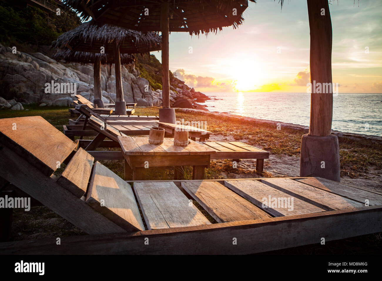beautiful sunset sky and wood desk on sea beach Stock Photo - Alamy
