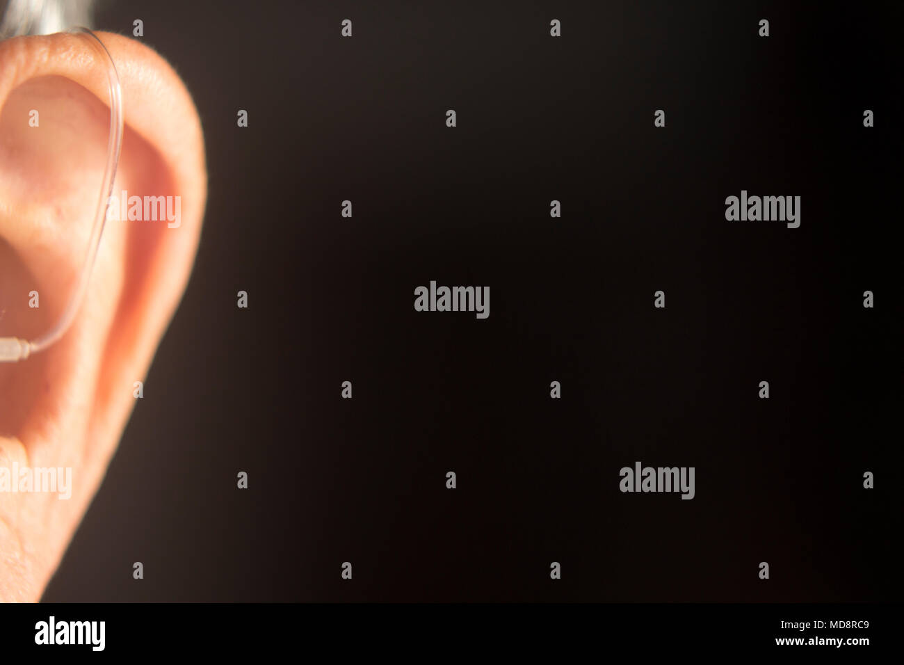 Digital modern hearing aid in the ear of aged old man Stock Photo - Alamy
