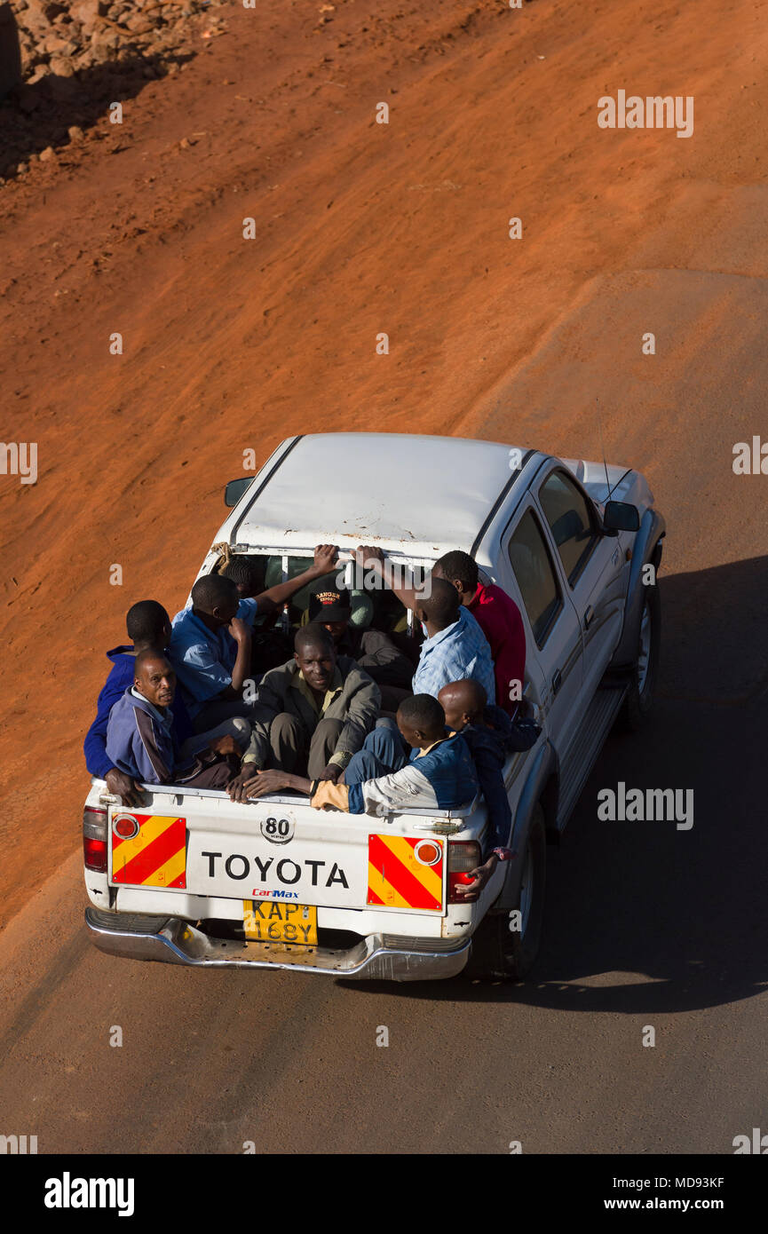 People returning home after work, in the back of a lorry, Ngong Road ...