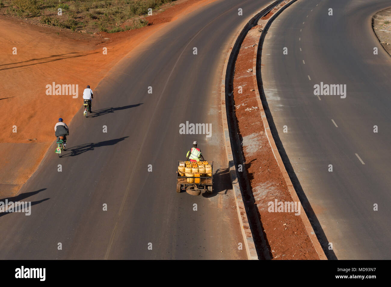 Delivery man pulling cart loaded hi-res stock photography and images ...