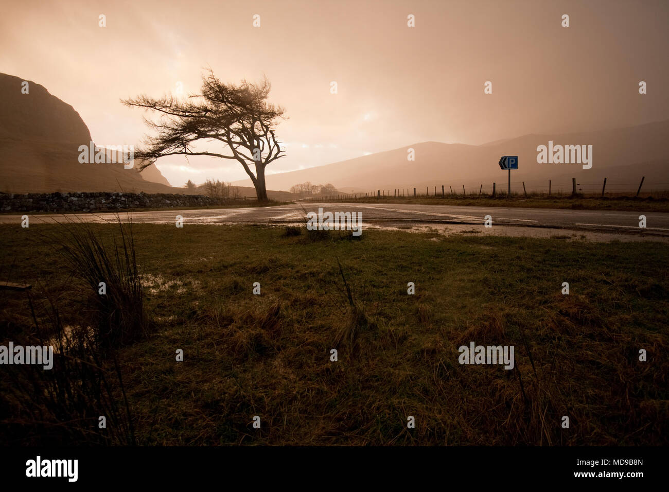 A rain storm at the Inchnadamph Hotel on the North Coast 500. An old ...
