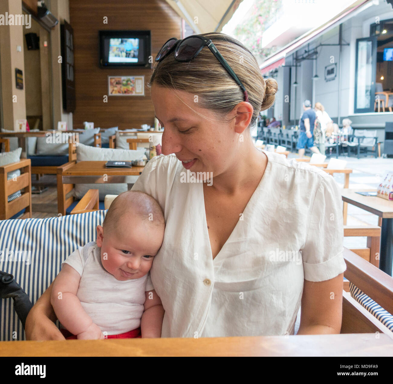 Mother with her little baby at restaurant, Heraklion, Greece Stock ...