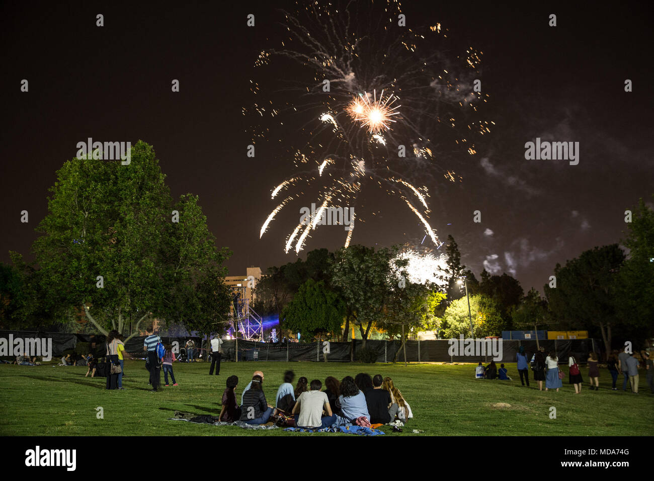 Jerusalem. 19th Apr, 2018. People watch fireworks during a celebration ...