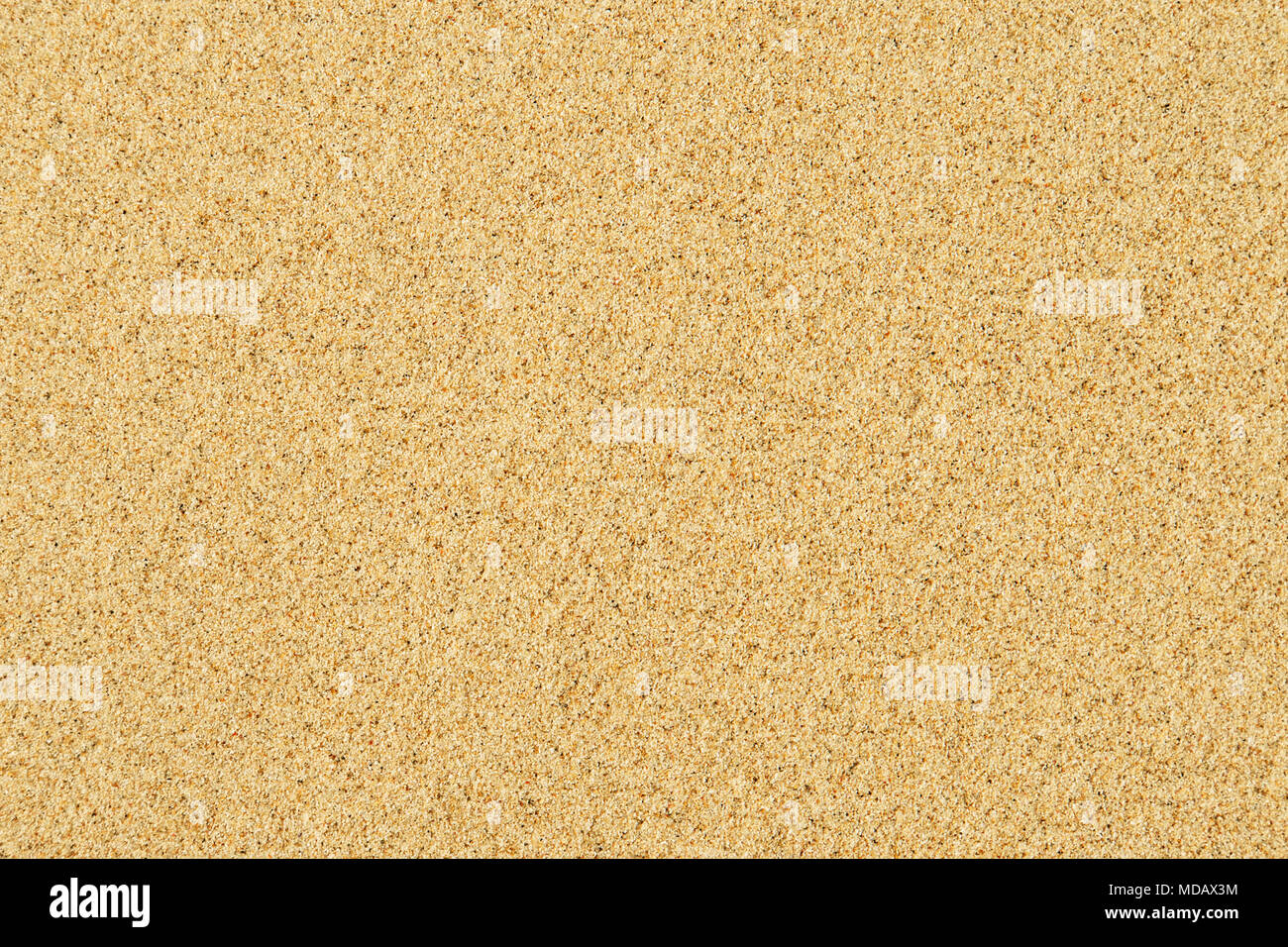 Sand background texture. Yellow sea sand on the beach Stock Photo - Alamy