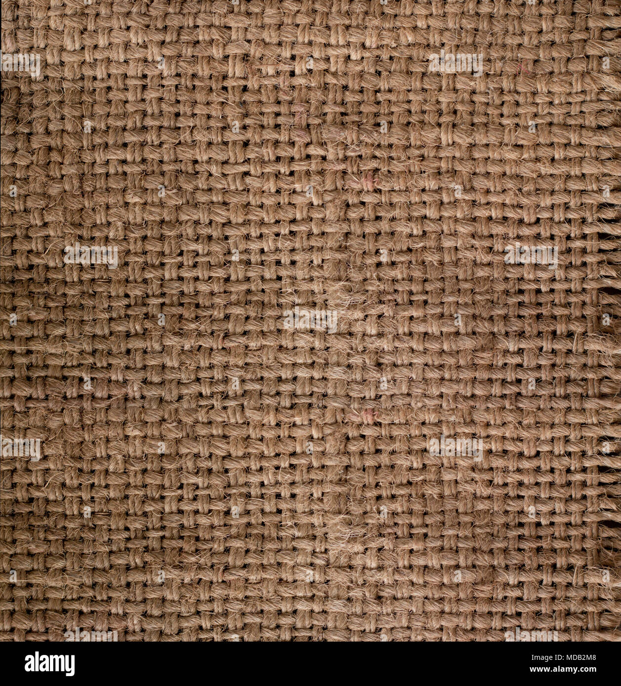 Texture of a sacking. Canvas fabric texture. Background of burlap hessian sacking. Brown fabric ...