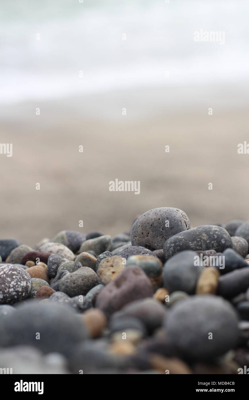 Grey pebble beach water hi-res stock photography and images - Alamy
