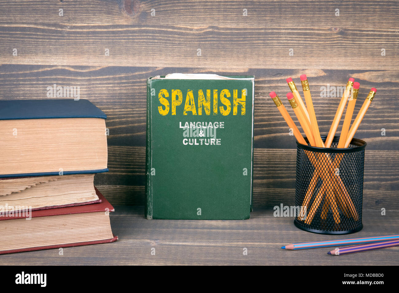 Spanish language and culture concept. Book on a wooden background Stock ...