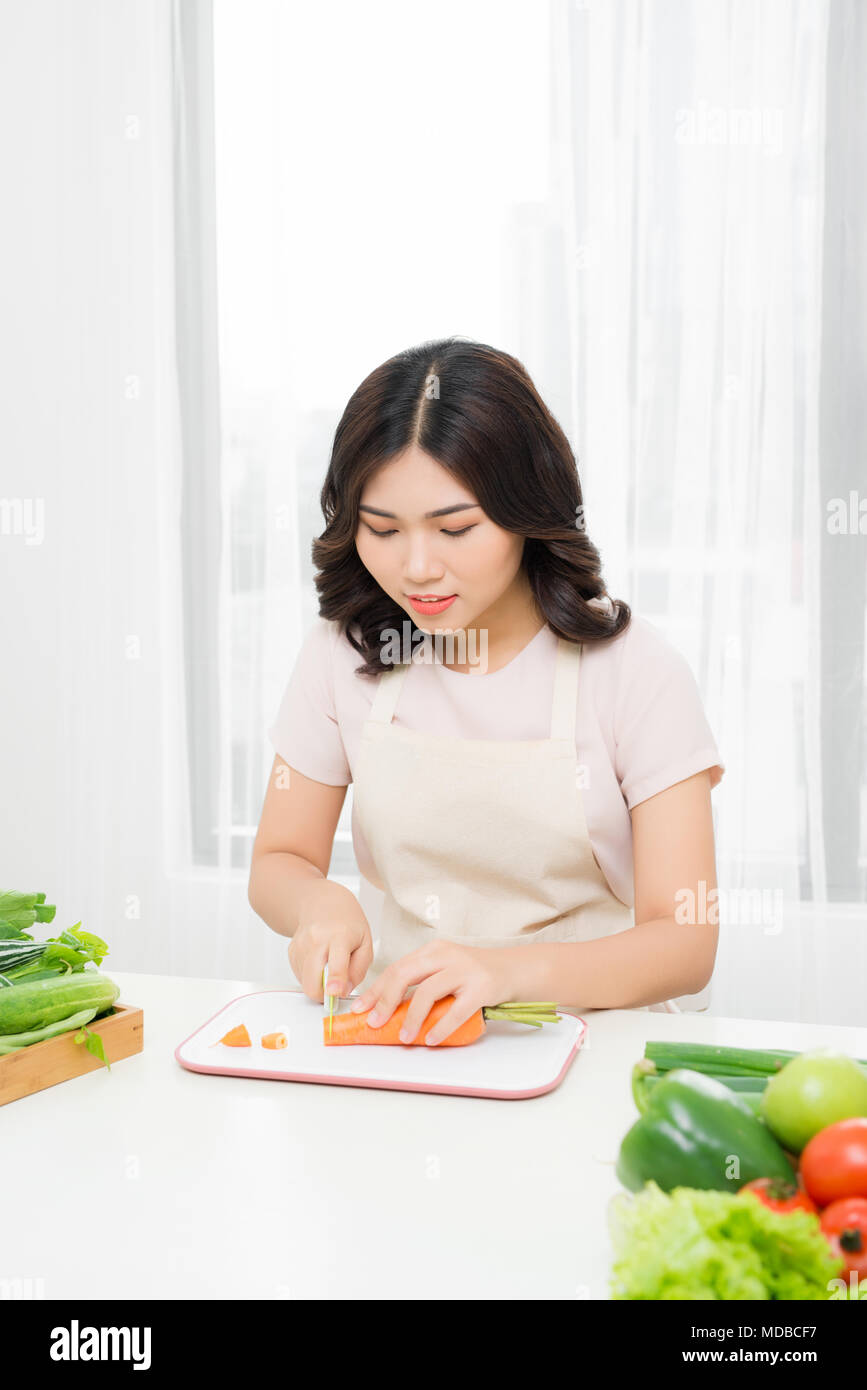 Healthy food. Asian woman cooking in the kitchen Stock Photo - Alamy