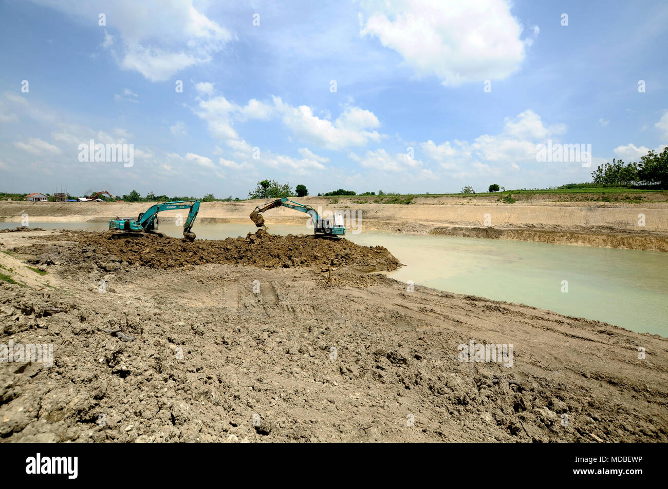 Two Excavators Dig The Ground Stock Photo - Alamy