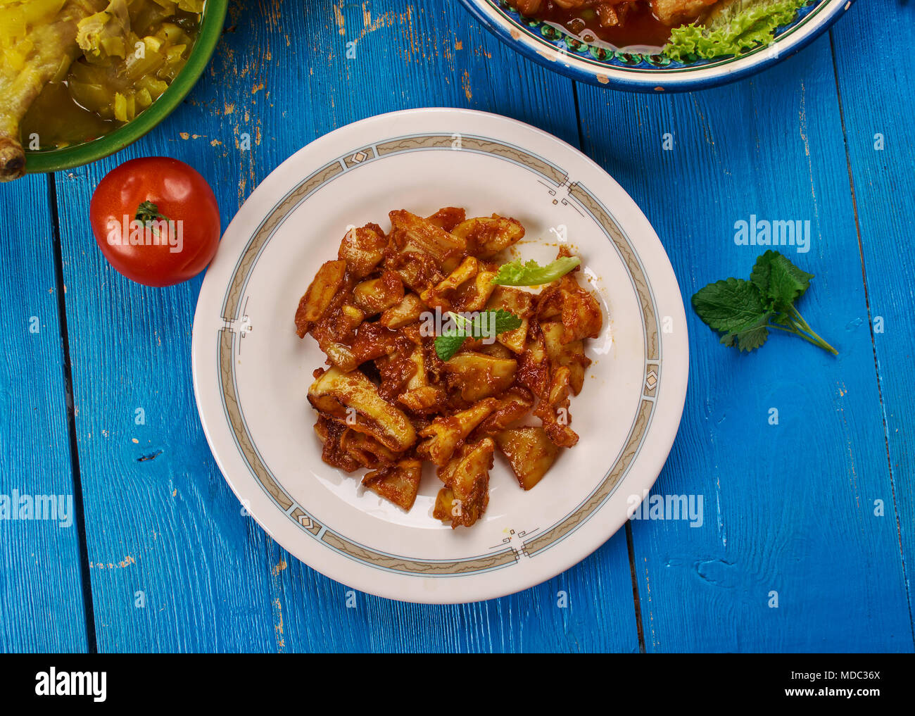 Indian cuisine . koonthal - Squid Kerala Roast ,Traditional assorted ...