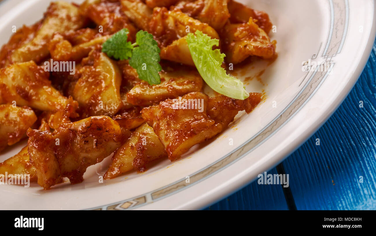 Indian cuisine . koonthal - Squid Kerala Roast ,Traditional assorted ...