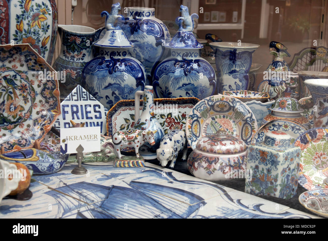 Amsterdam, Holland - 14 April 20018 Showcases of Dutch shops with blue ...