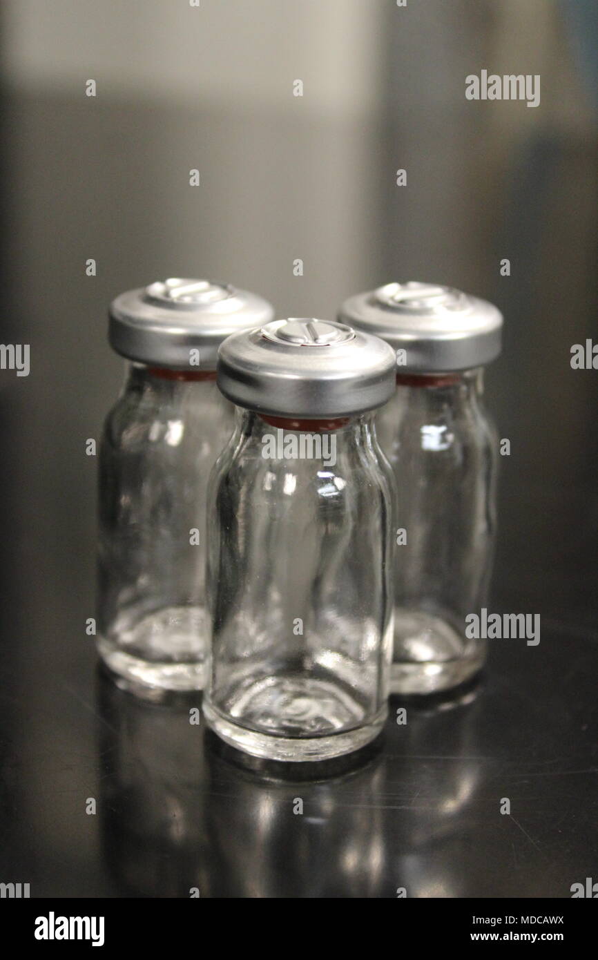 Empty Glass Medication Vials on Counter Stock Photo - Alamy