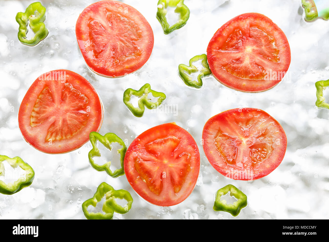 Profile features of fresh tomatoes and green peppers Stock Photo - Alamy
