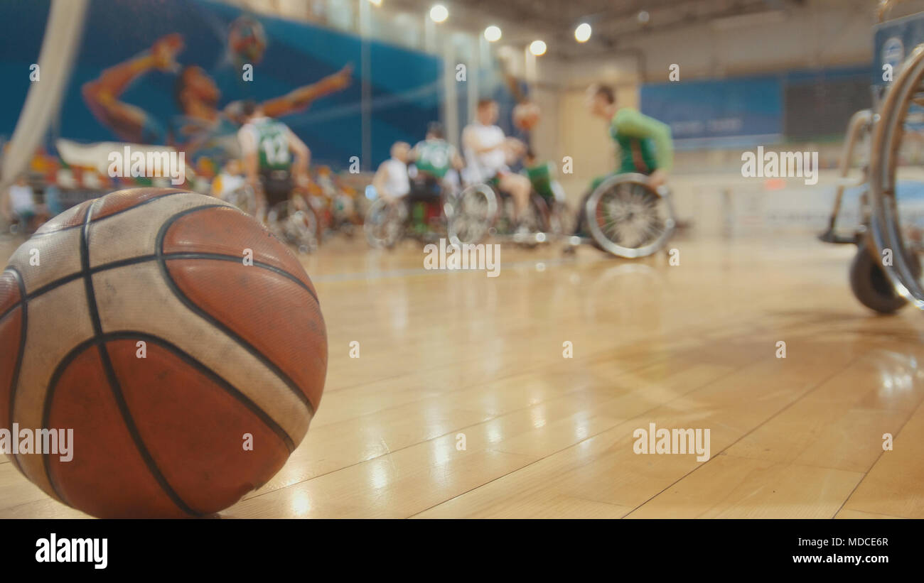 Ball of basketball during training for disabled wheelchair sportsmen ...