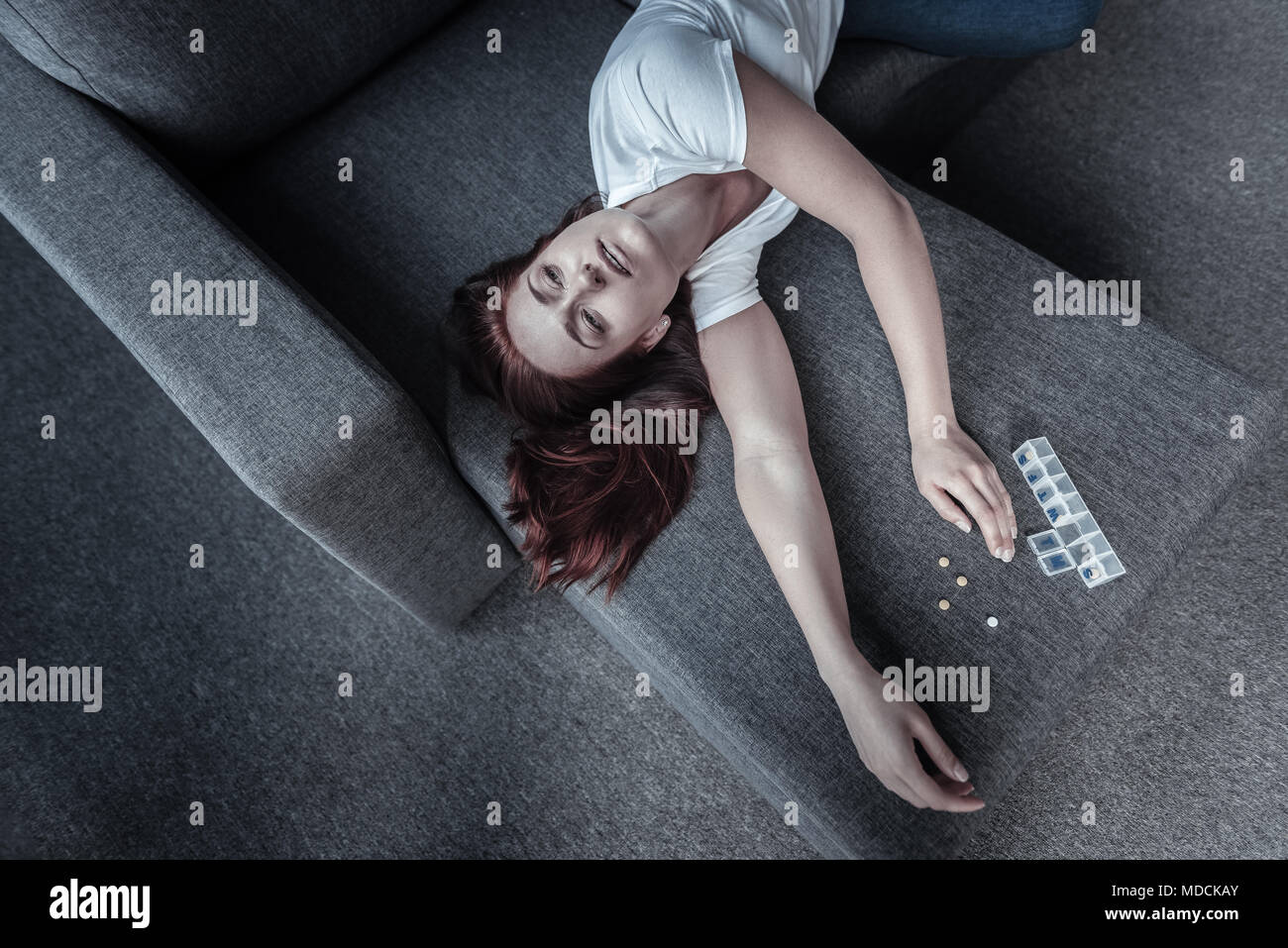 Lamentable deplorable woman taking antidepressant Stock Photo - Alamy