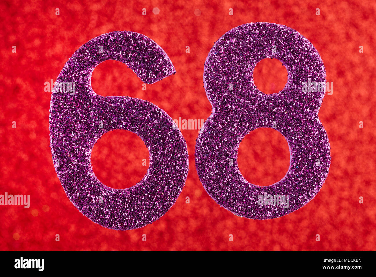 Number sixty-eight purple color over a red background. Anniversary ...