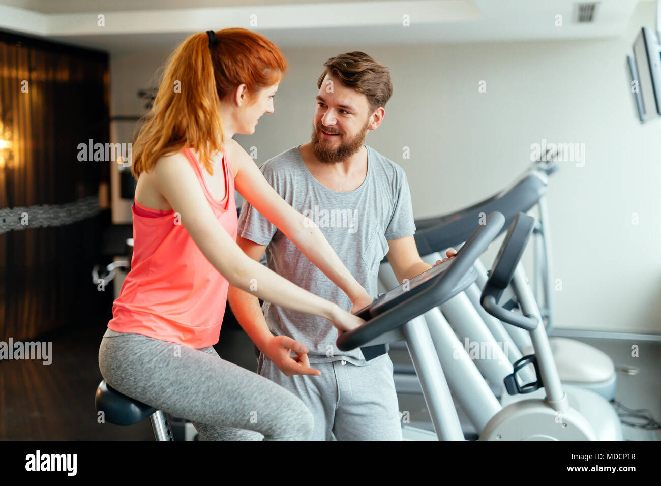 Personal trainer giving instructions Stock Photo - Alamy