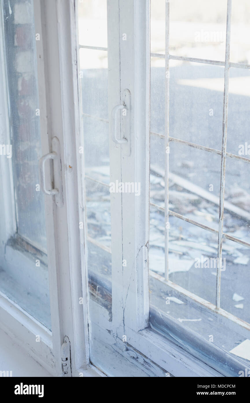 White painted window with old wooden frame.The interior of the ...