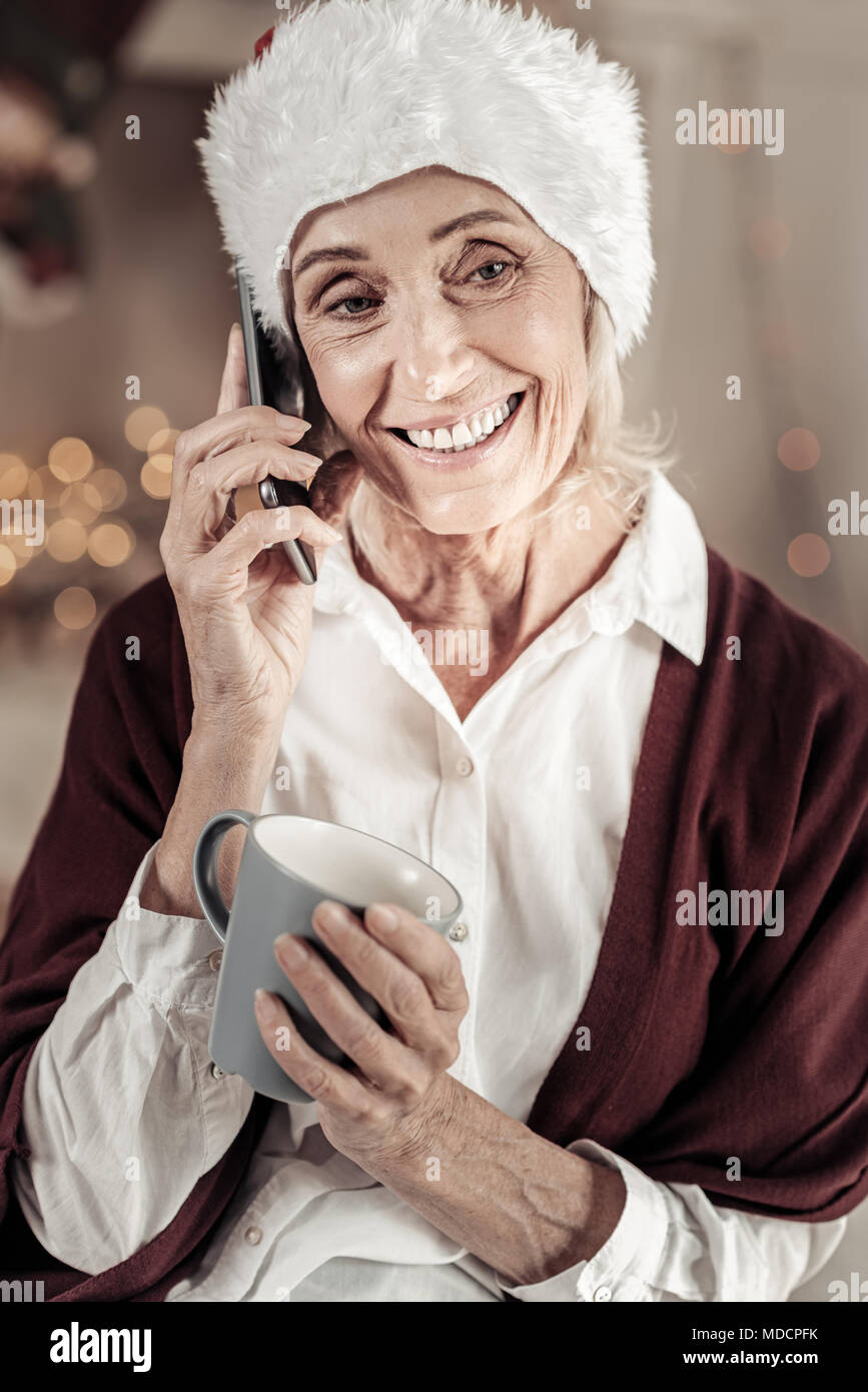 Positive delighted woman talking per telephone Stock Photo - Alamy