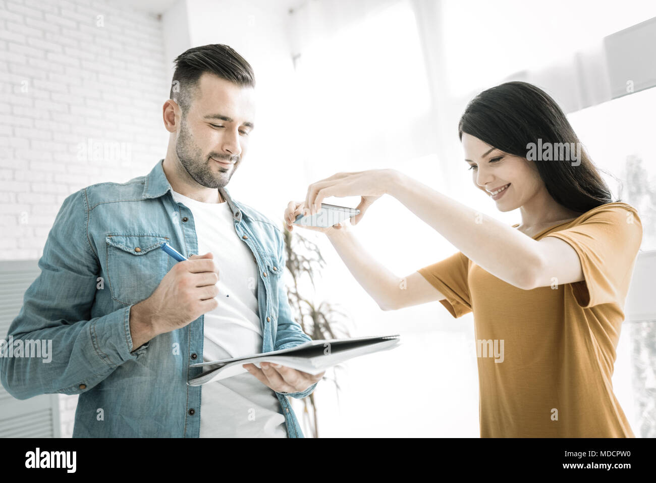 Positive two students exchanging information Stock Photo - Alamy
